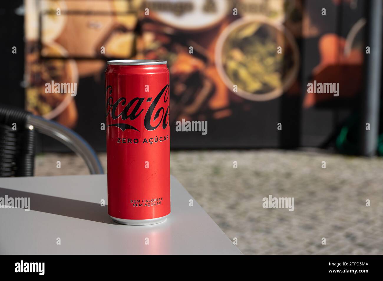 Coca Cola can on a terrace table Stock Photo - Alamy