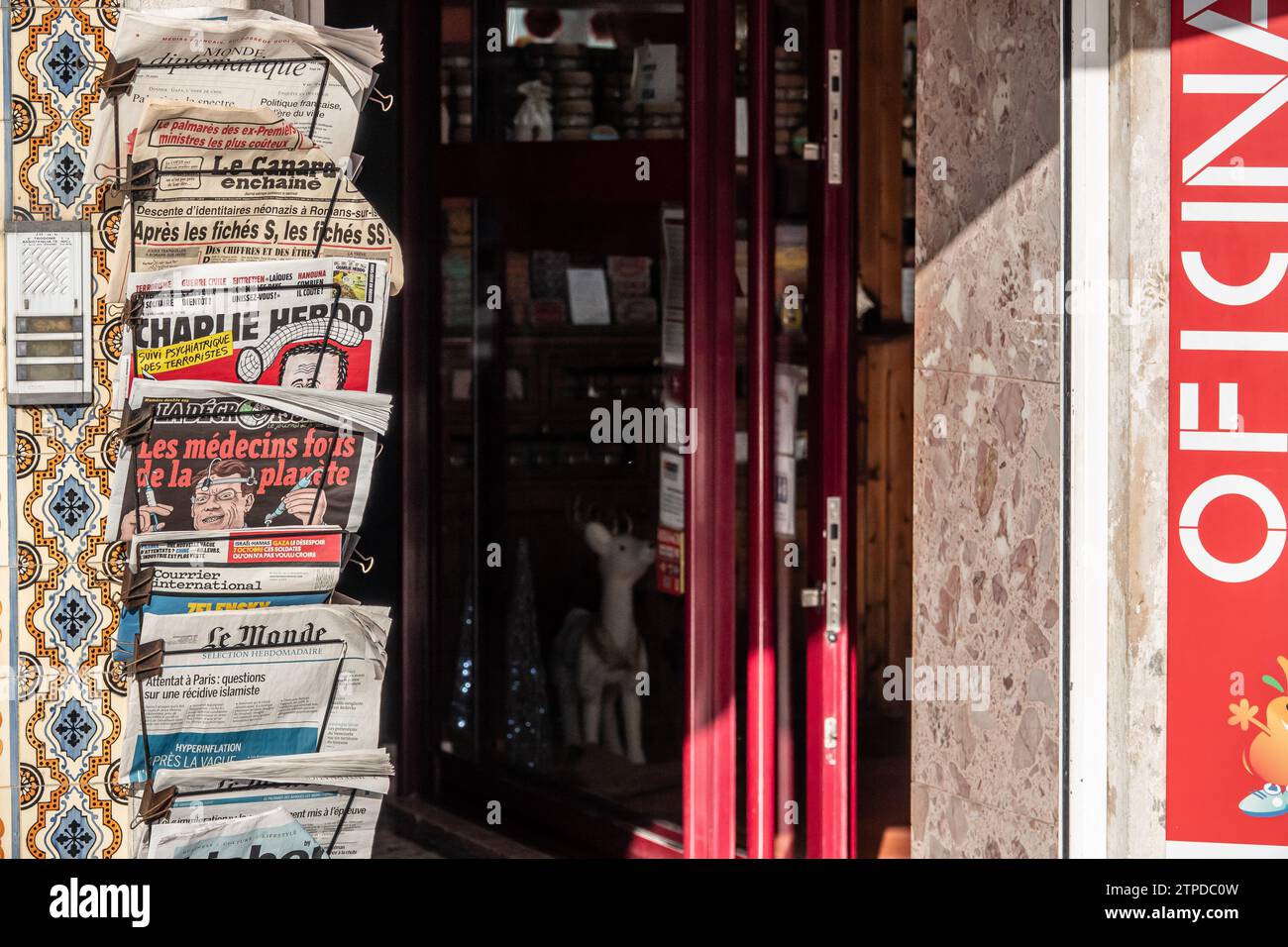 Newspapers at the door of a news shop Stock Photo - Alamy