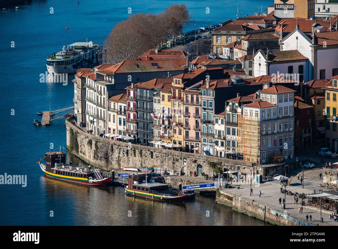 Image of the city of Porto, with its colored houses in the port next to ...