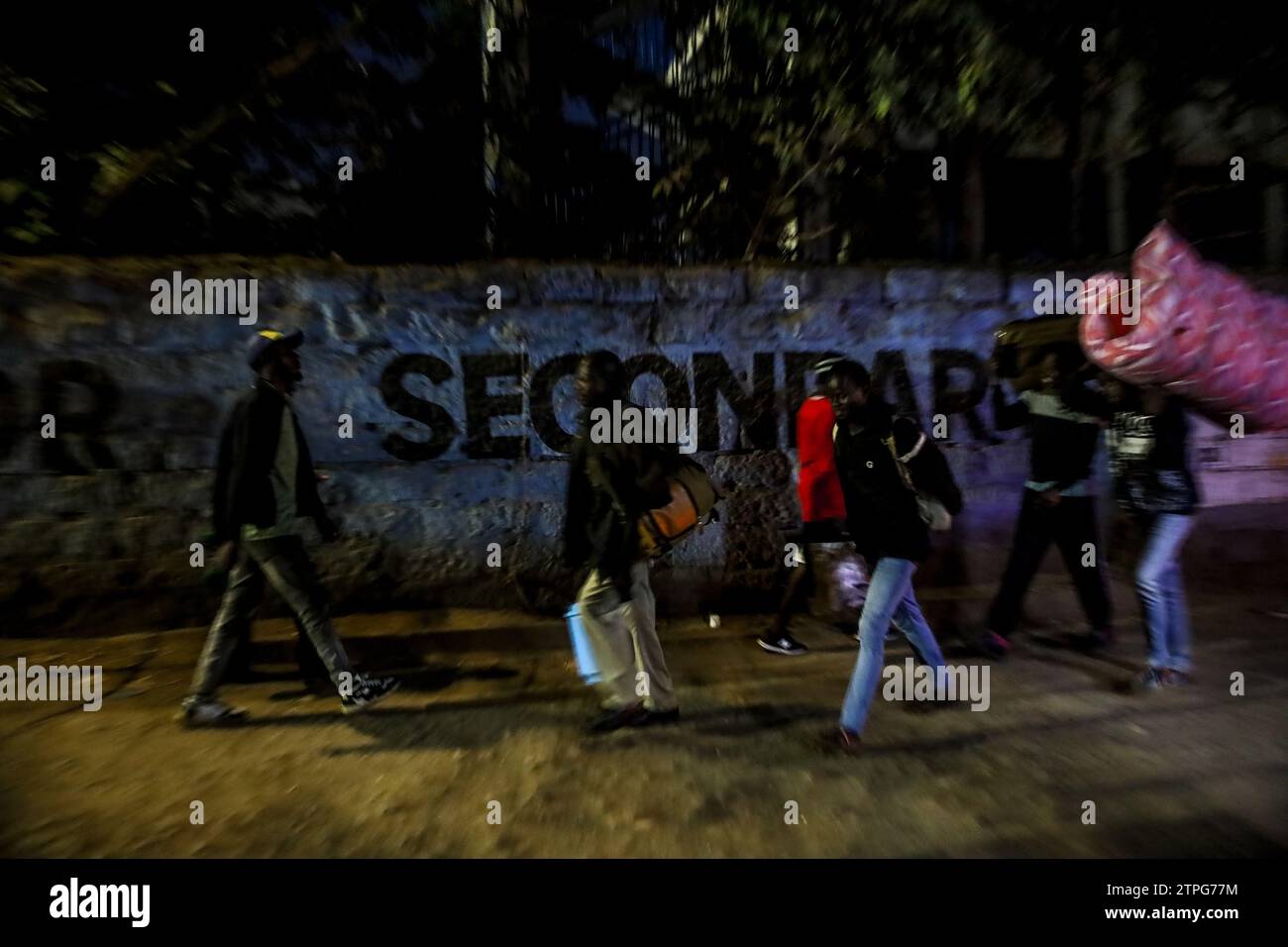 Pedestrians walk past the busy streets in Kibera Slum, Nairobi. A view ...