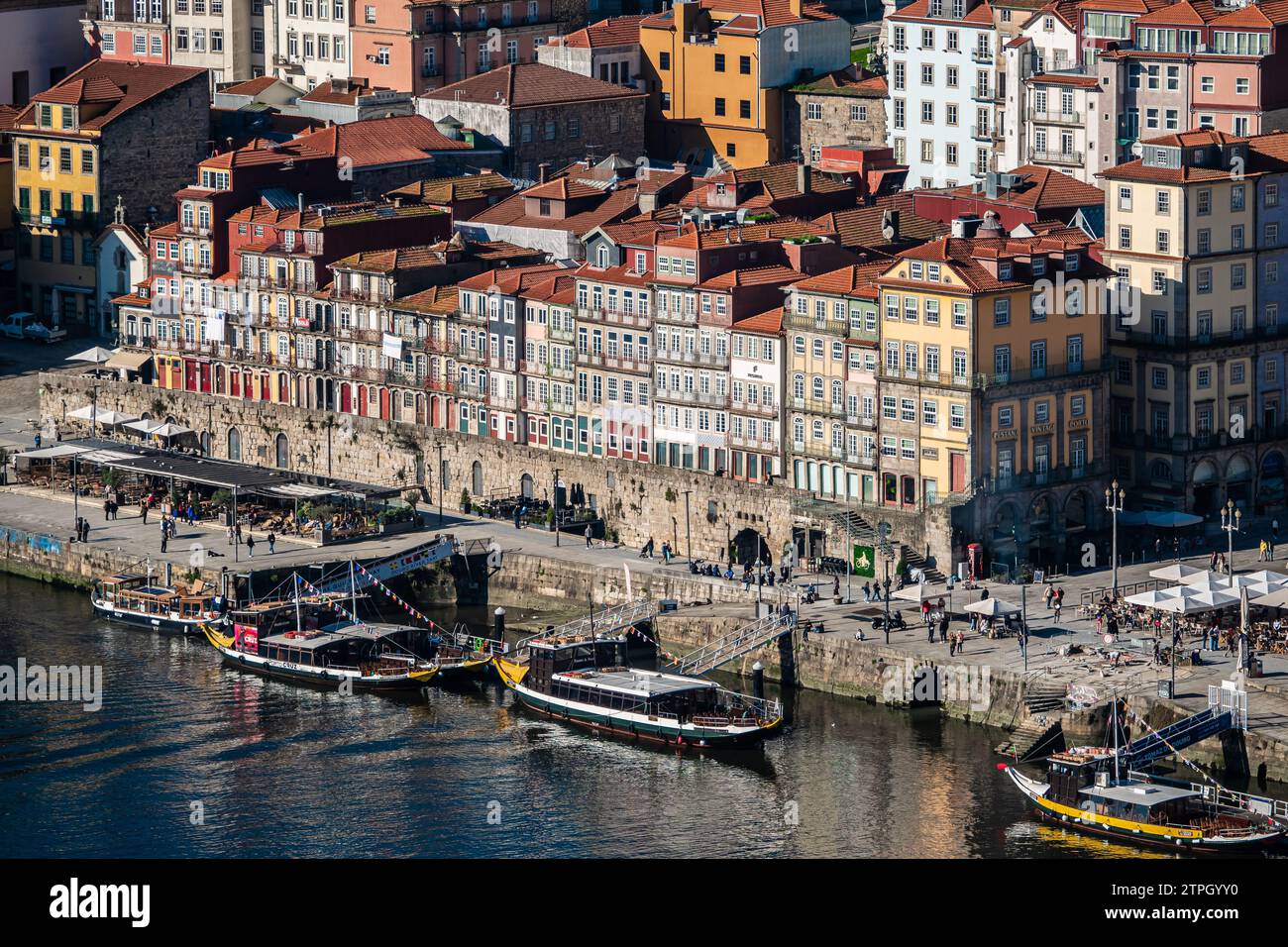 Image of the city of Porto, with its colored houses in the port next to ...