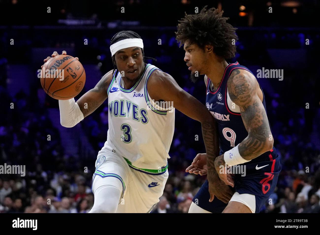 Minnesota Timberwolves' Jaden McDaniels, left, tries to get past ...