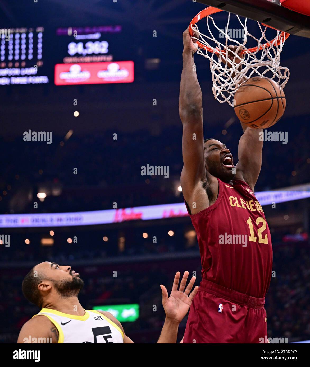 Cleveland Cavaliers center Tristan Thompson dunks over Utah Jazz guard ...