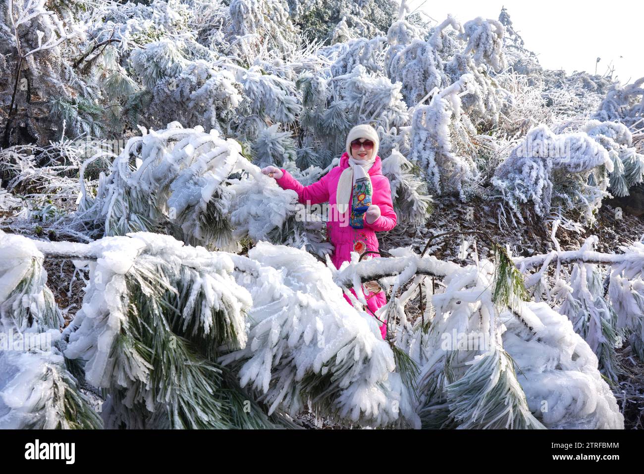 GUILIN, CHINA - DECEMBER 20, 2023 - A tourist enjoys the rime scenery ...