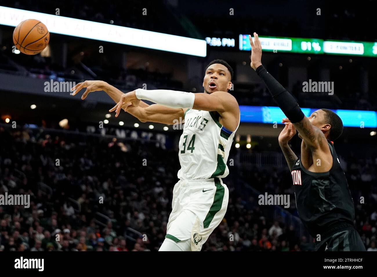 Milwaukee Bucks' Giannis Antetokounmpo (34) passes the ball while being defended by Houston ...