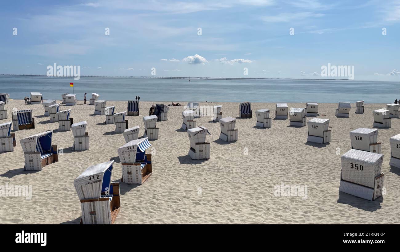 Serene beach day with charming wicker chairs Stock Photo - Alamy