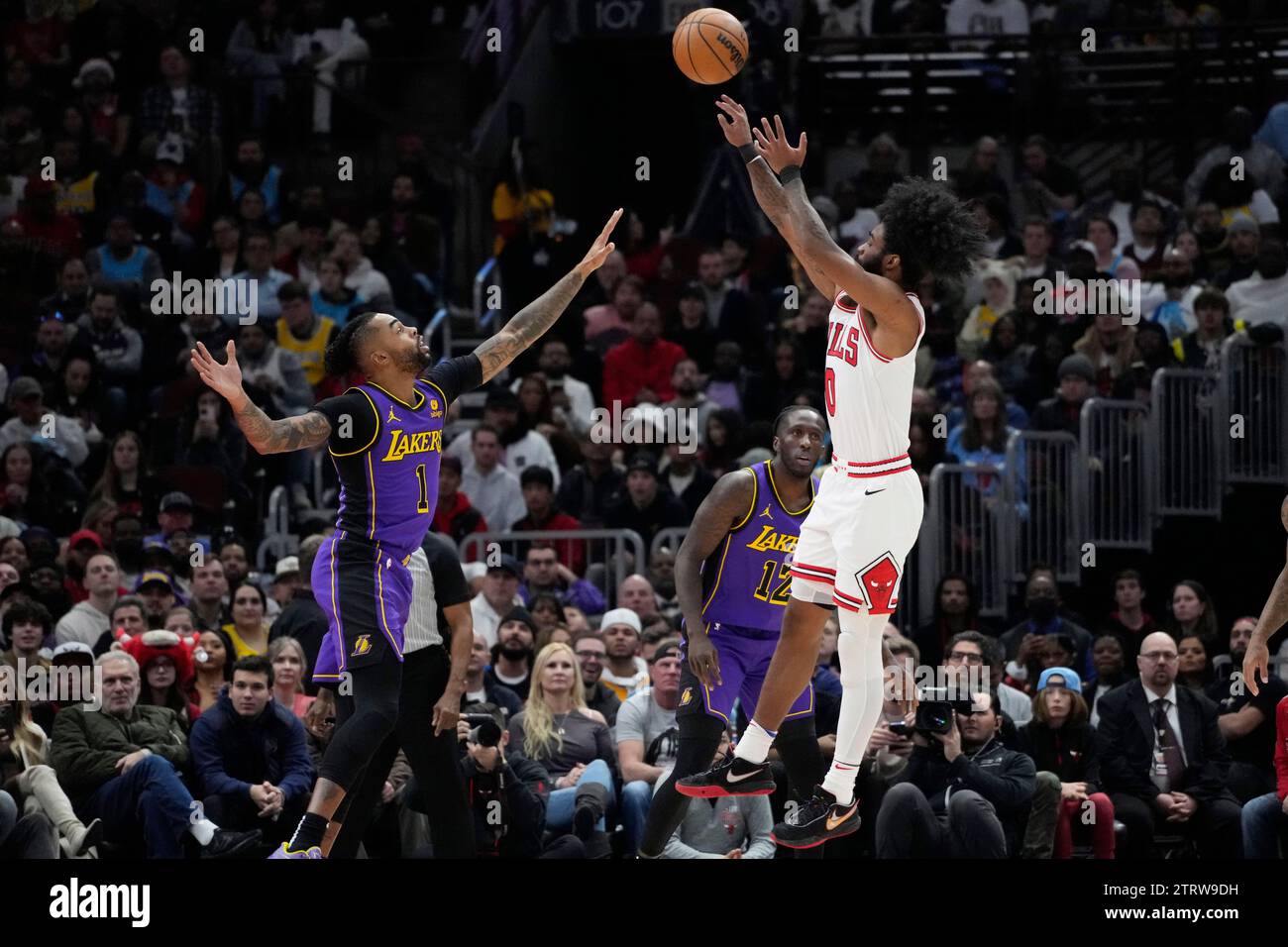 Chicago Bulls guard Coby White, right, shoots against Los Angeles ...