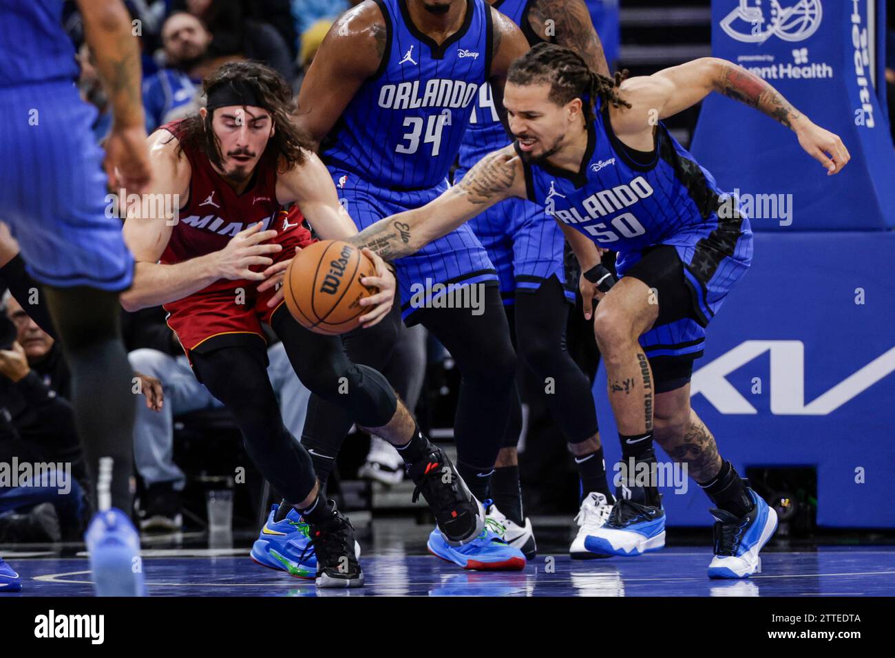 Miami Heat guard Jaime Jaquez Jr., left and Orlando Magic guard Cole ...