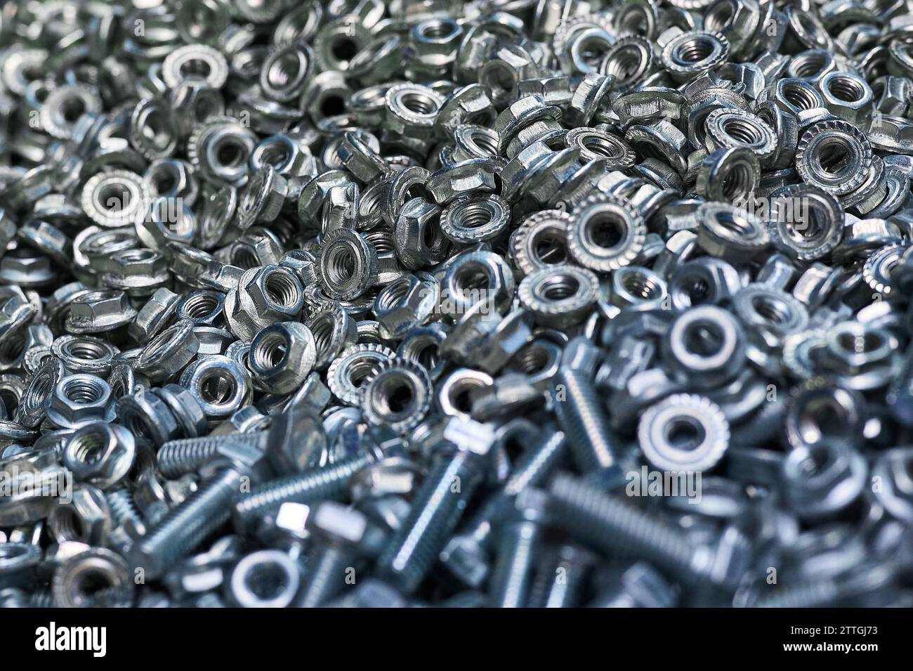 Metal screws in container on workbench at car service Stock Photo - Alamy