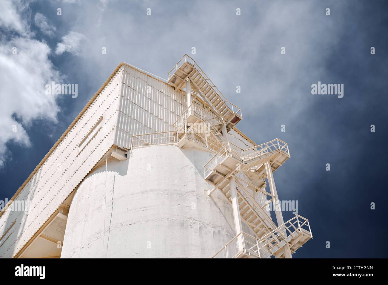 High concrete silos for storage of finished lime products Stock Photo ...