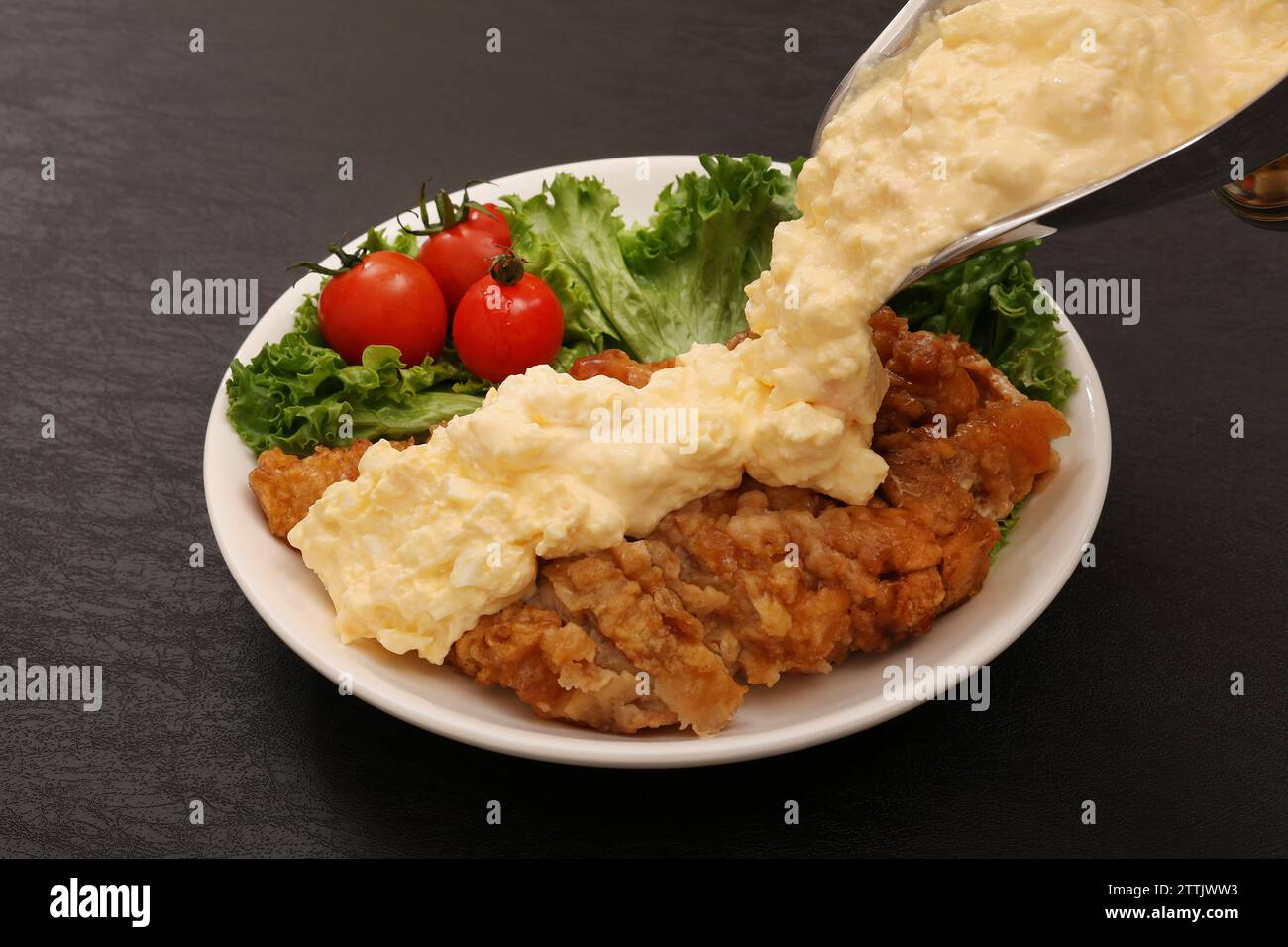 Fried Chicken Dipped in Sour Sauce Stock Photo - Alamy