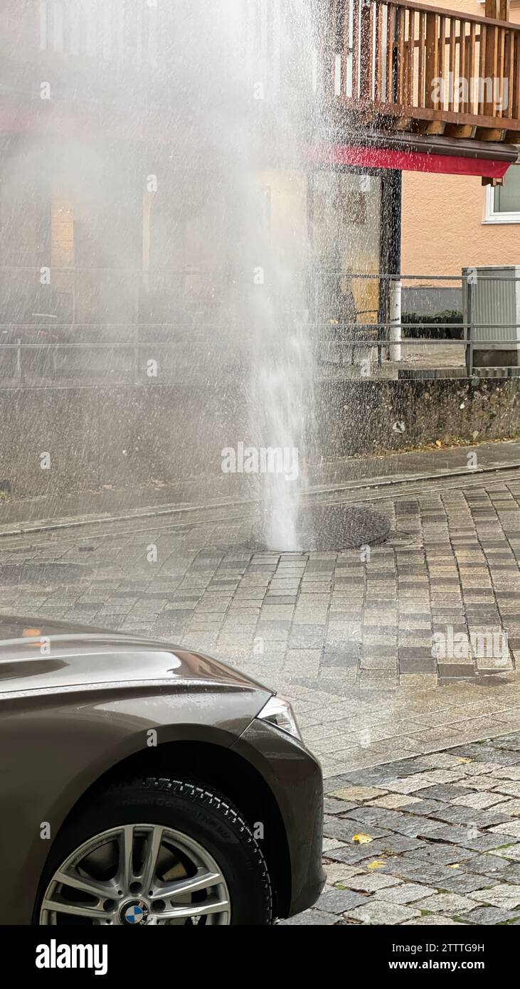 Urban Water Burst from Pavement Stock Photo - Alamy