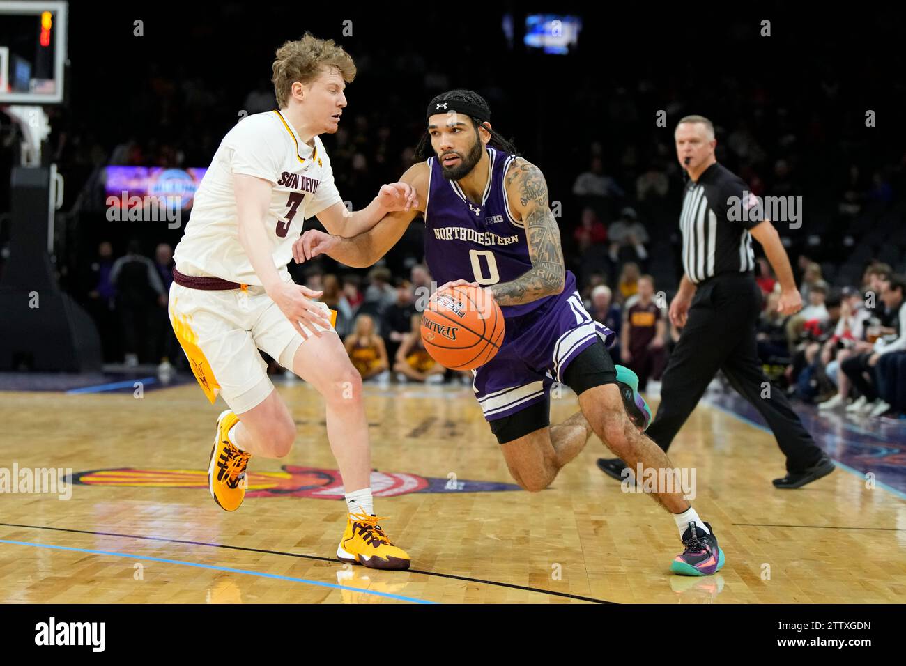 Northwestern guard Boo Buie (0) drives on Arizona State guard Brycen ...