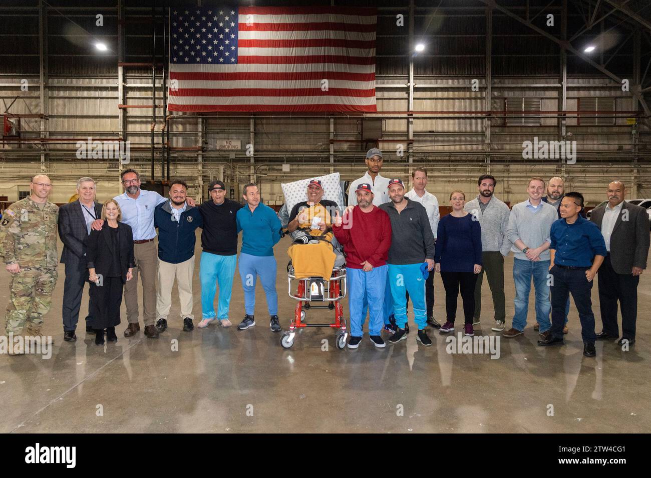 Freed Americans Joseph Ryan Cristella, backwards cap sixth from left ...