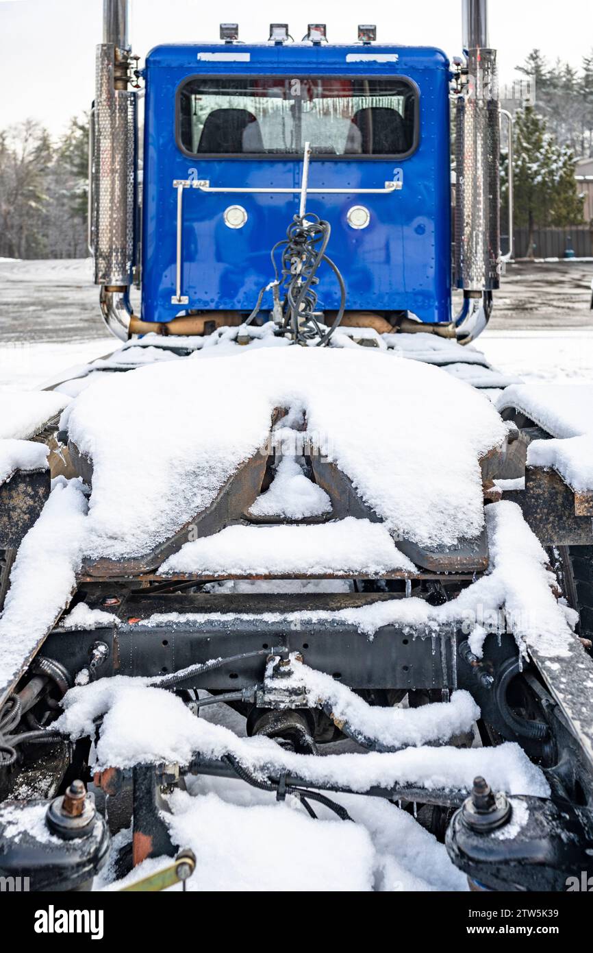 Blue high cab big rig semi truck tractor with fifth wheel covered with ...