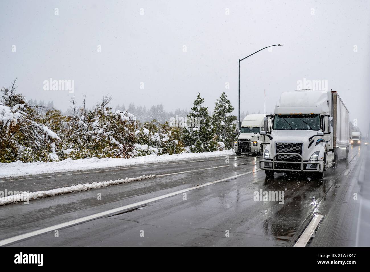 Industrial grade white big rig long hauler semi trucks transporting ...