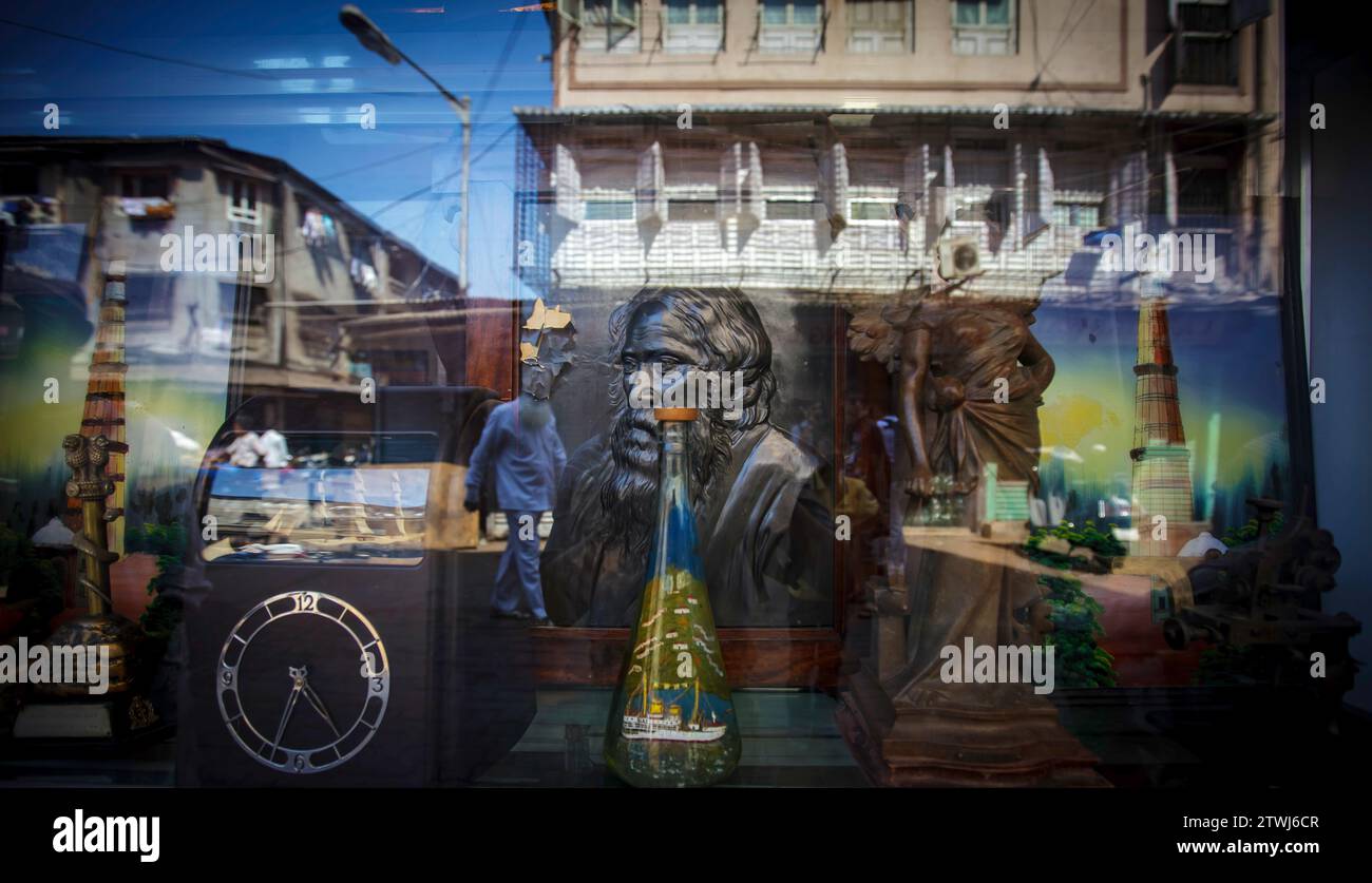 Window reflection of a shop for vintage artefacts at Chor Bazaar Mumbai ...