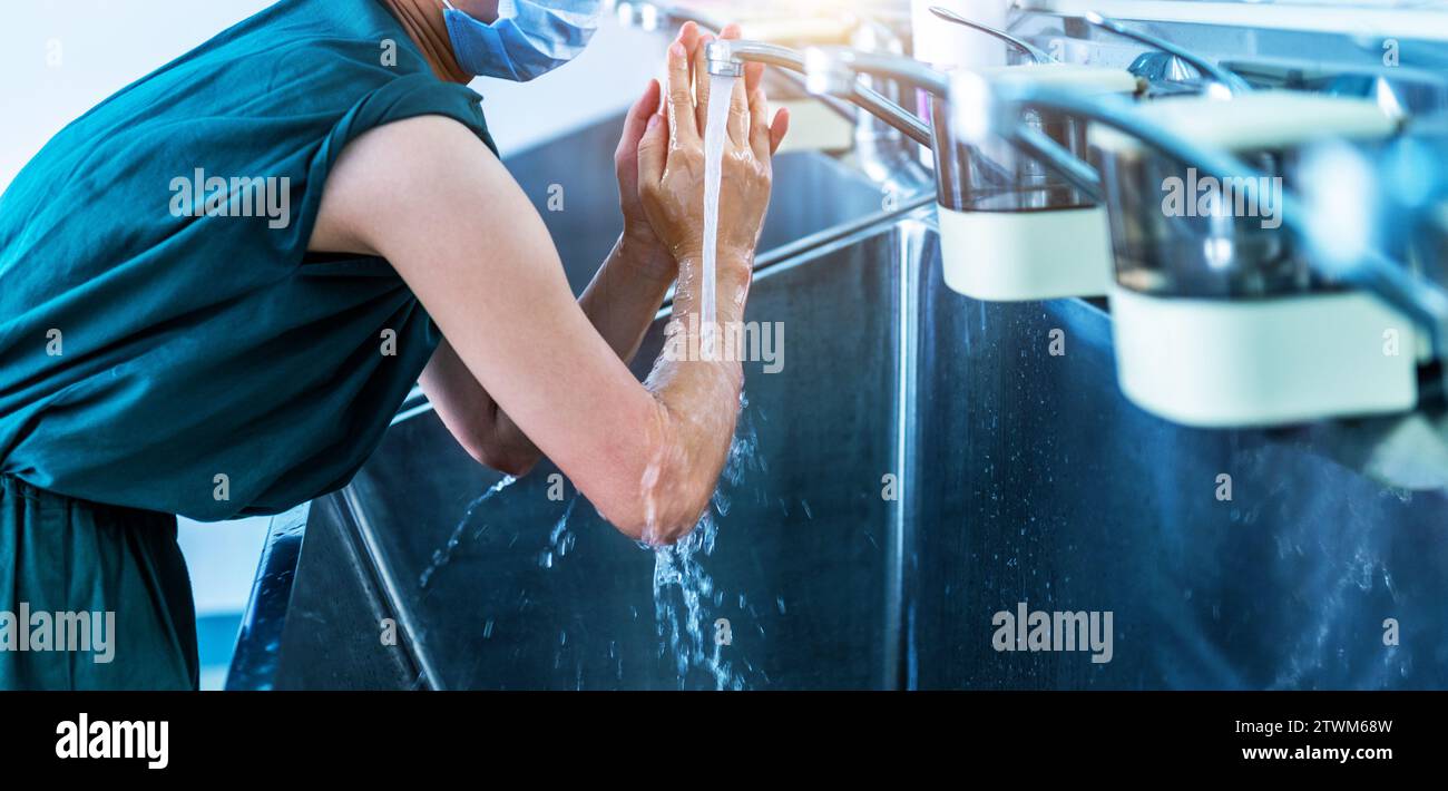 Young female doctor washing hands before operation Stock Photo - Alamy