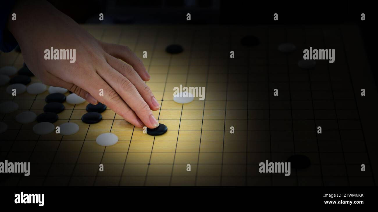 Detail of woman hand playing chinese boardgame Stock Photo - Alamy