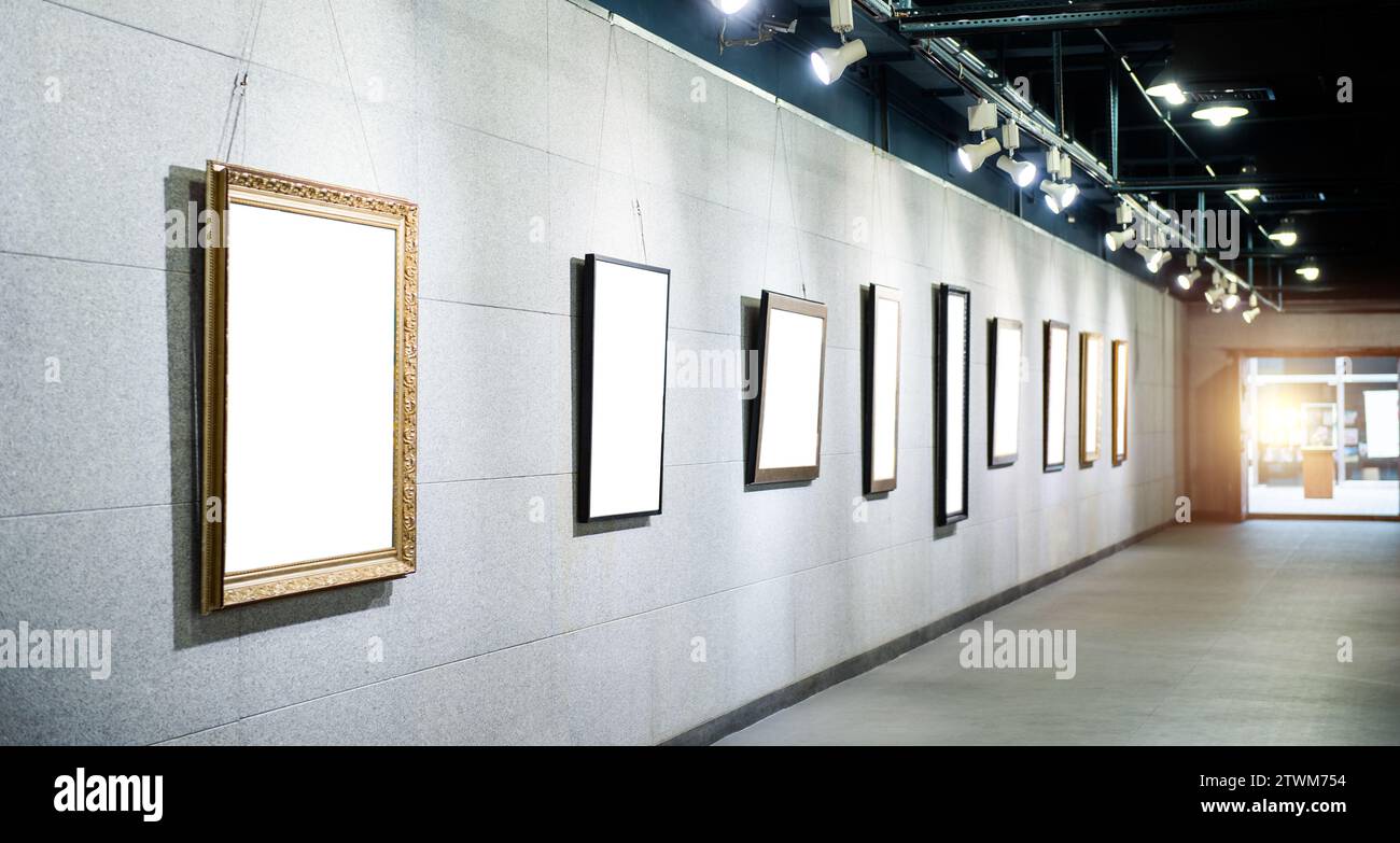 Gallery interior with group of empty frames on wall Stock Photo - Alamy