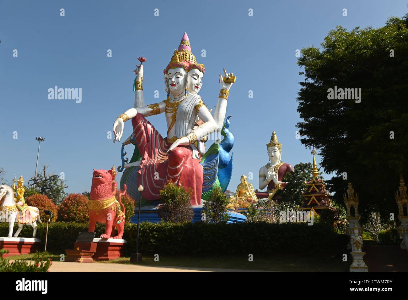 A large outdoor four-faced and four-hands Brahma statue represents the ...