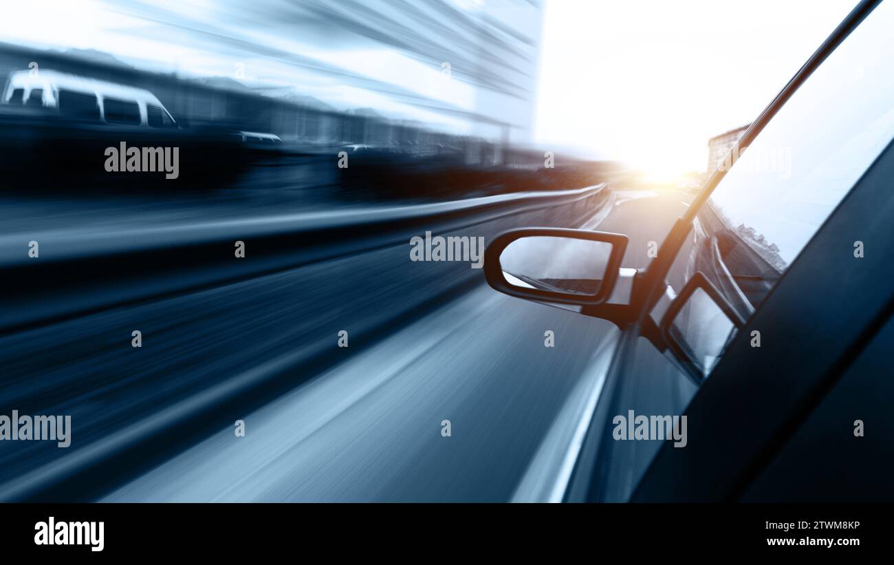 Car driving fast along the motorway, blue tone Stock Photo - Alamy