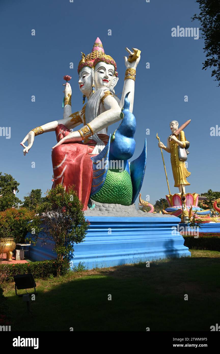 A large outdoor four-faced and four-hands Brahma statue represents the ...