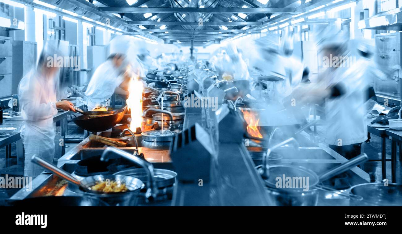 Motion chefs working in Chinese restaurant kitchen Stock Photo - Alamy