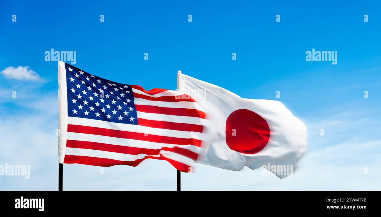 USA and Japan flags against blue sky background Stock Photo - Alamy