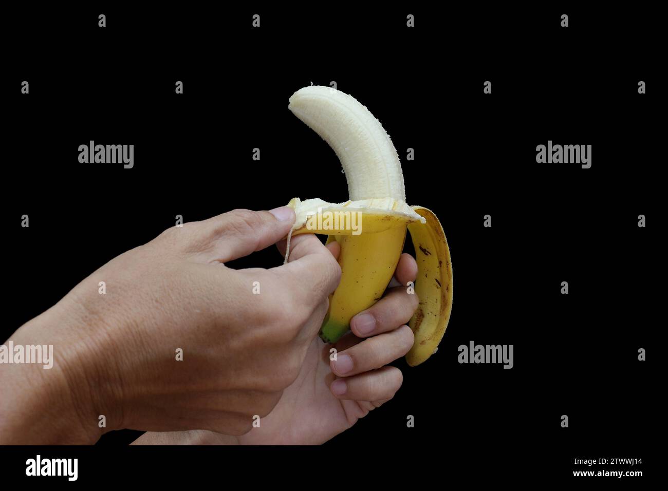 Peeled banana in hand hi-res stock photography and images - Alamy