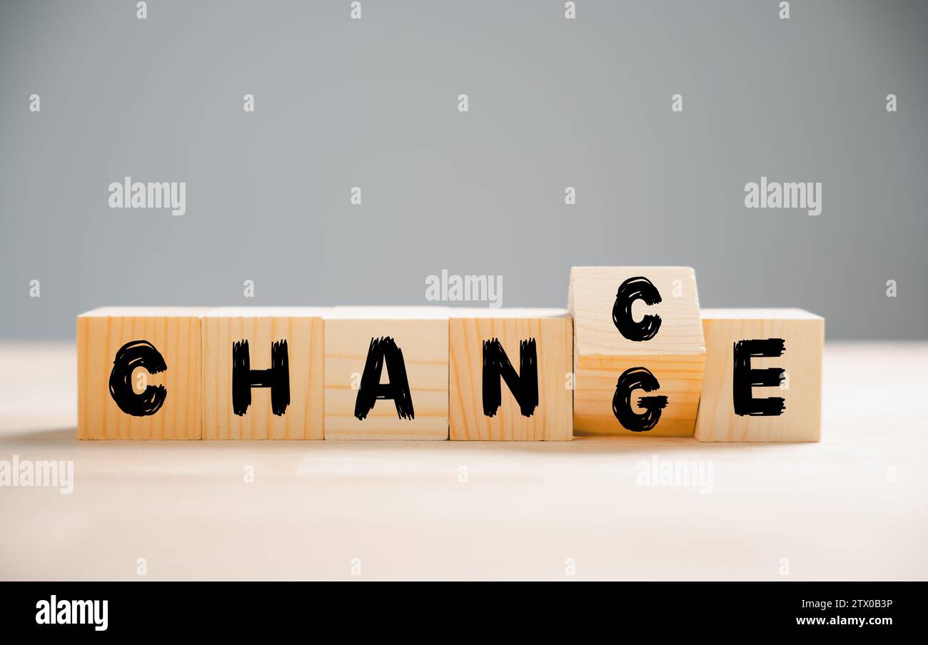 Flipping wooden cube block for Change to Chance Stock Photo - Alamy