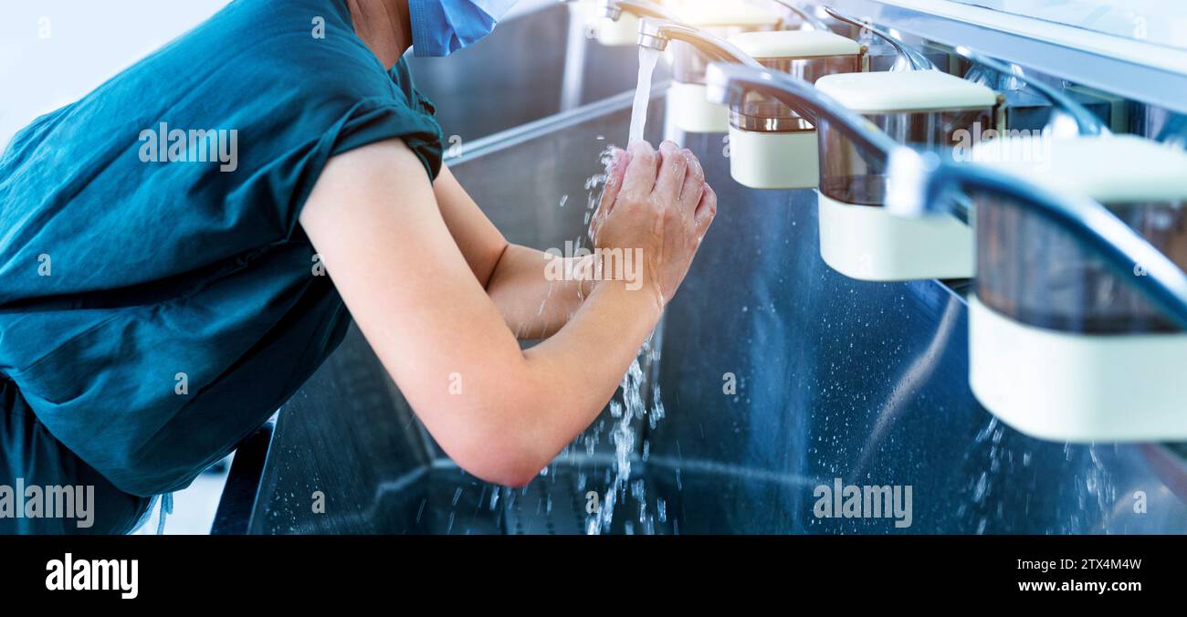 Young female doctor washing hands before operation Stock Photo - Alamy