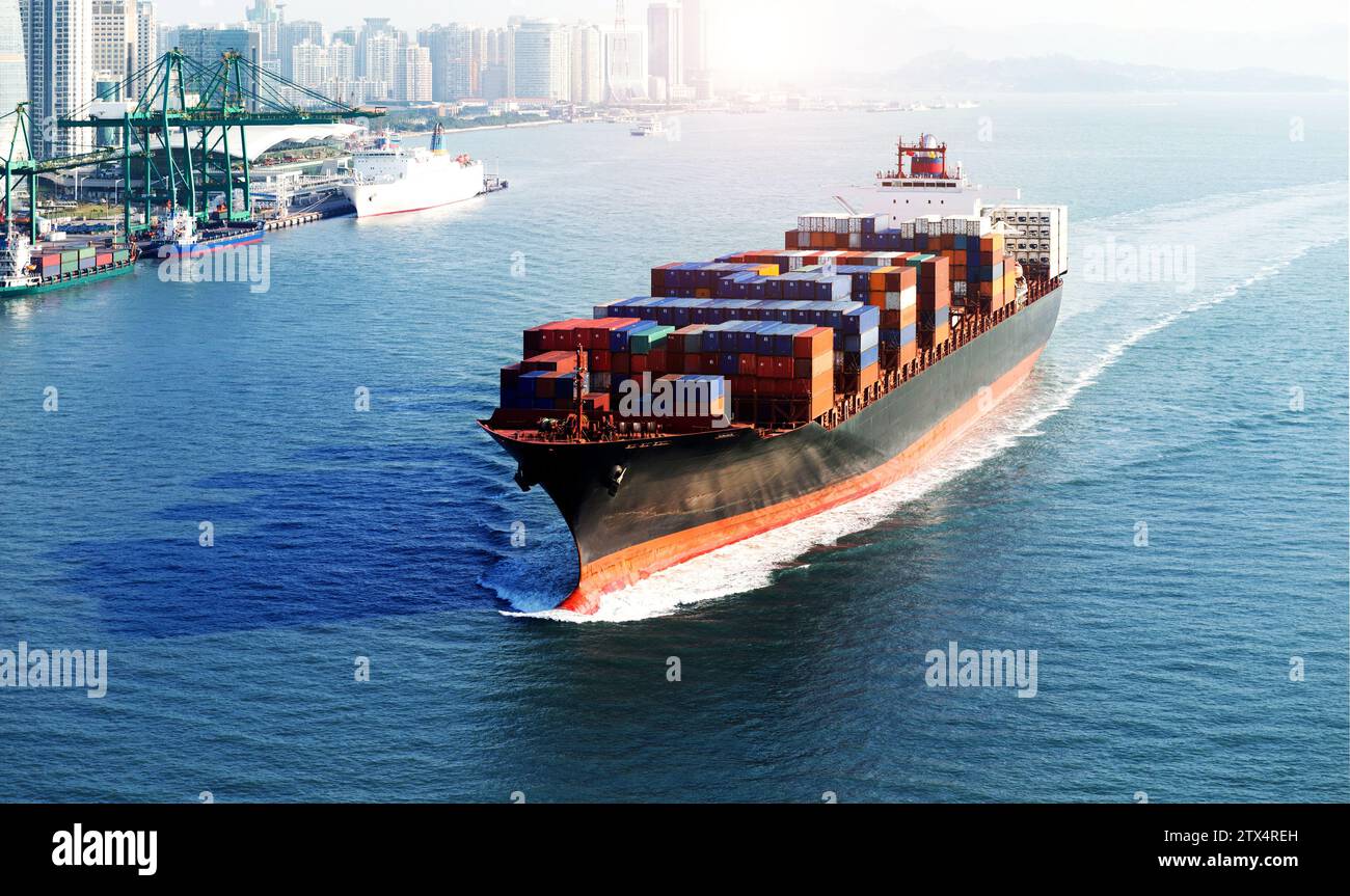 Large cargo container ship arriving in port Stock Photo - Alamy