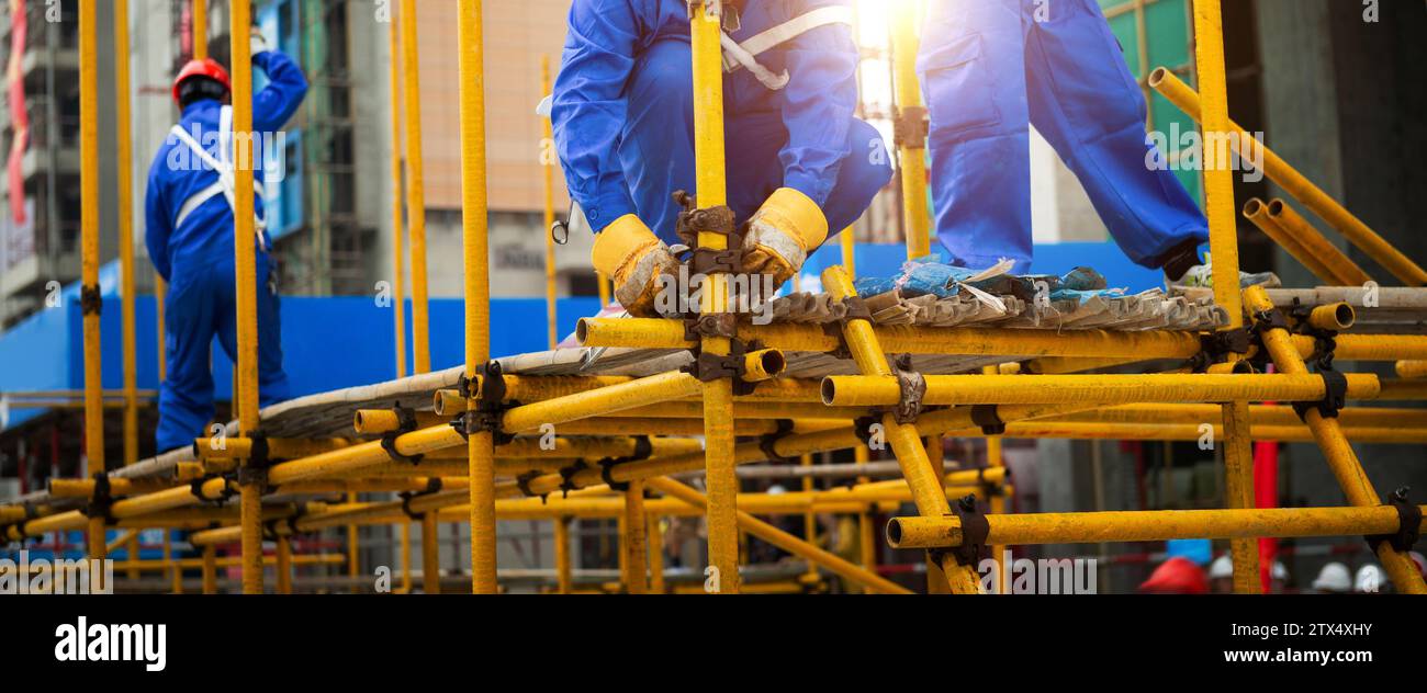 Construction worker climbing scaffolding hi-res stock photography and ...