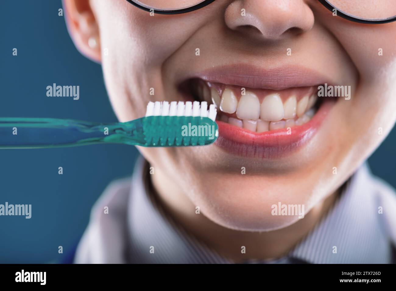 Close-up of a woman brushing her teeth, highlighting dental hygiene ...