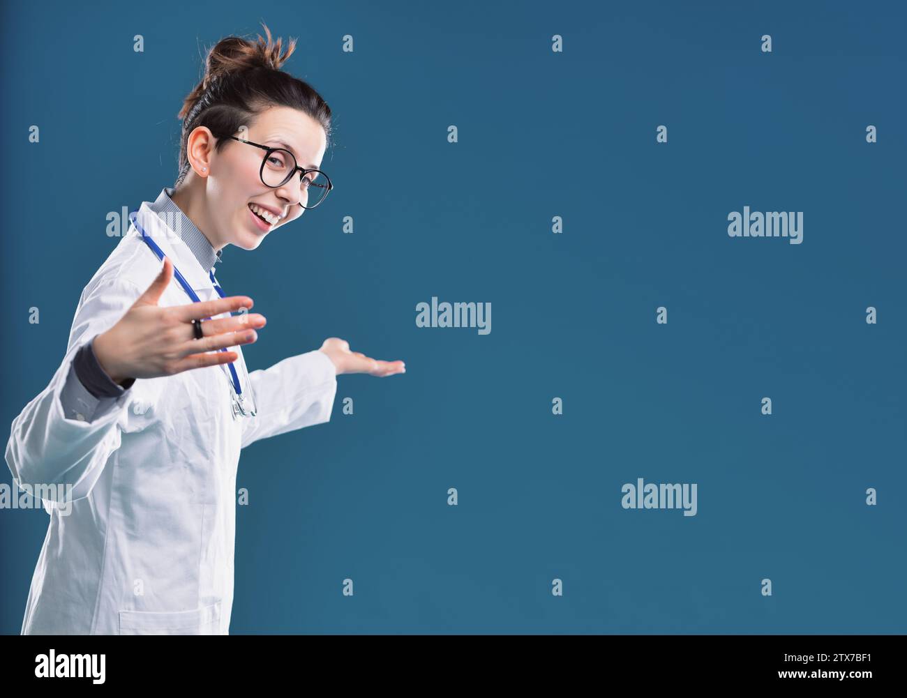 Energetic medical professional gestures openly, her lively expression ...