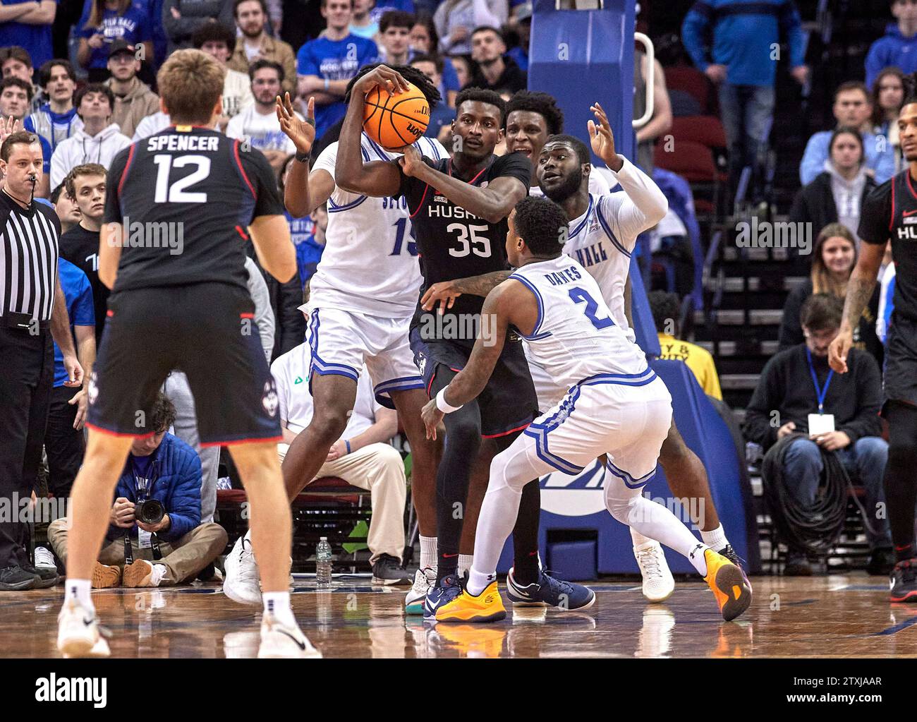 Connecticut Huskies forward Samson Johnson (35) gets pressure from ...