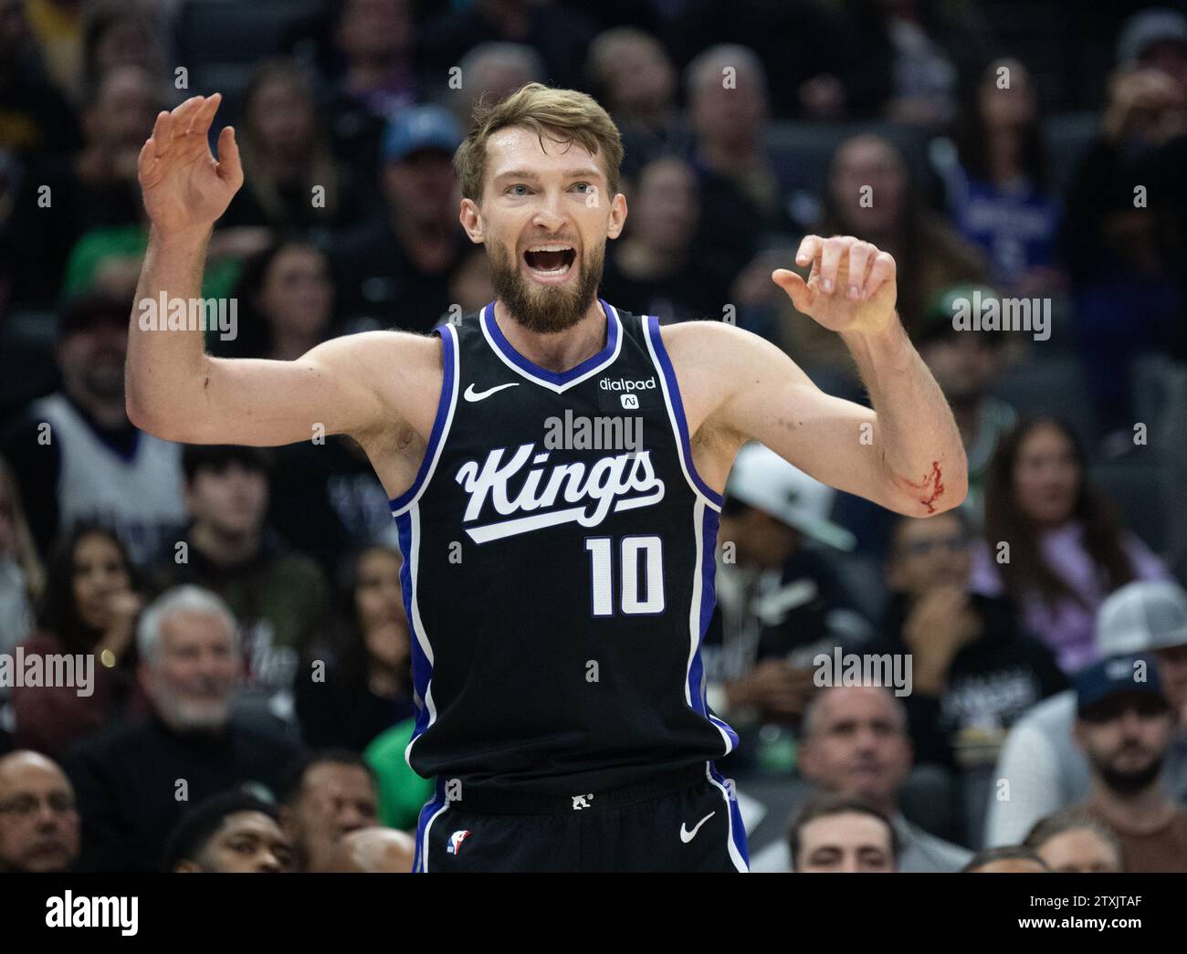 Sacramento, CA, USA. 20th Dec, 2023. Sacramento Kings forward Domantas Sabonis (10) reacts after ...