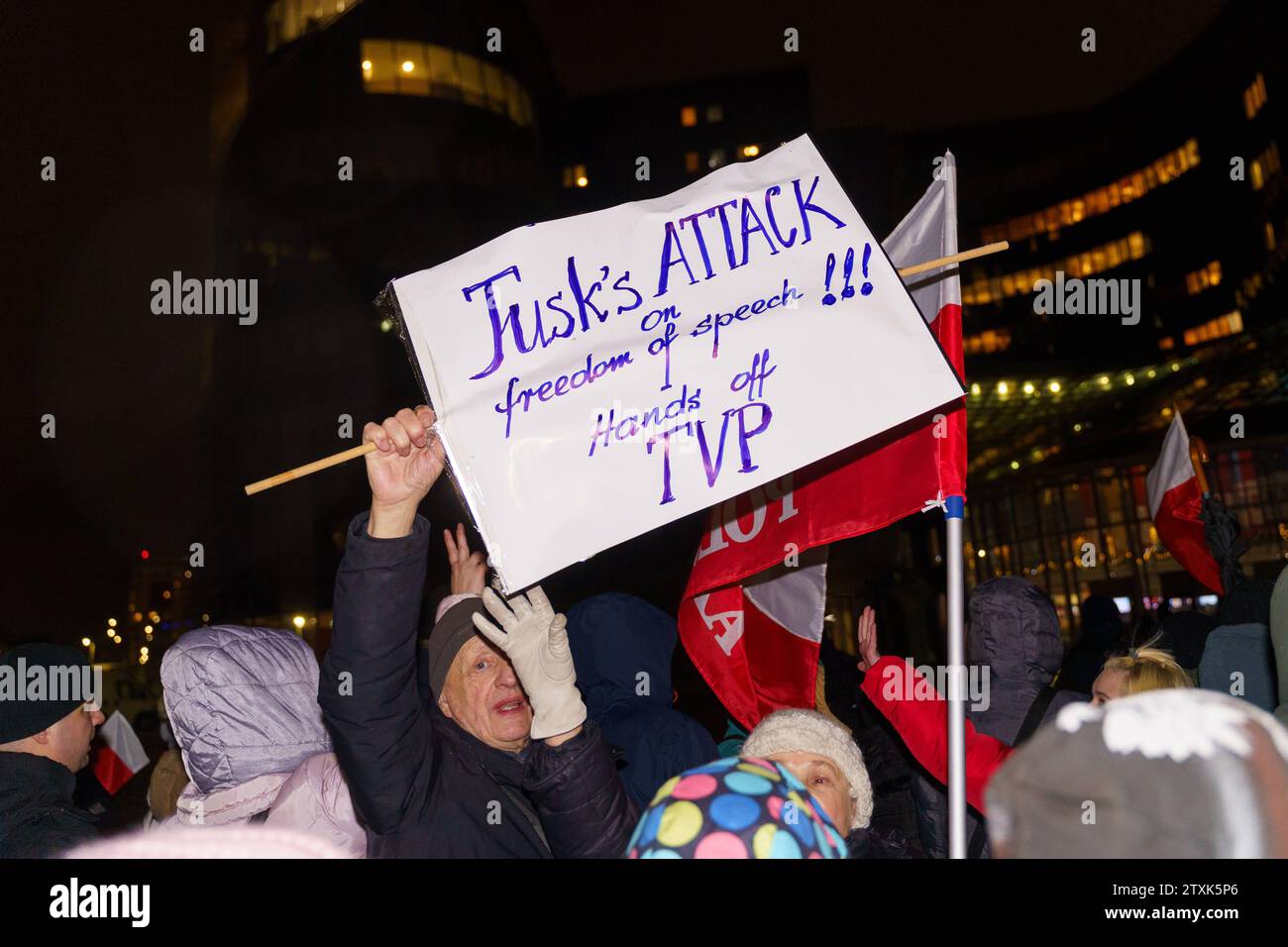 a demonstrator holds a banner during a protest to defend TVP against ...