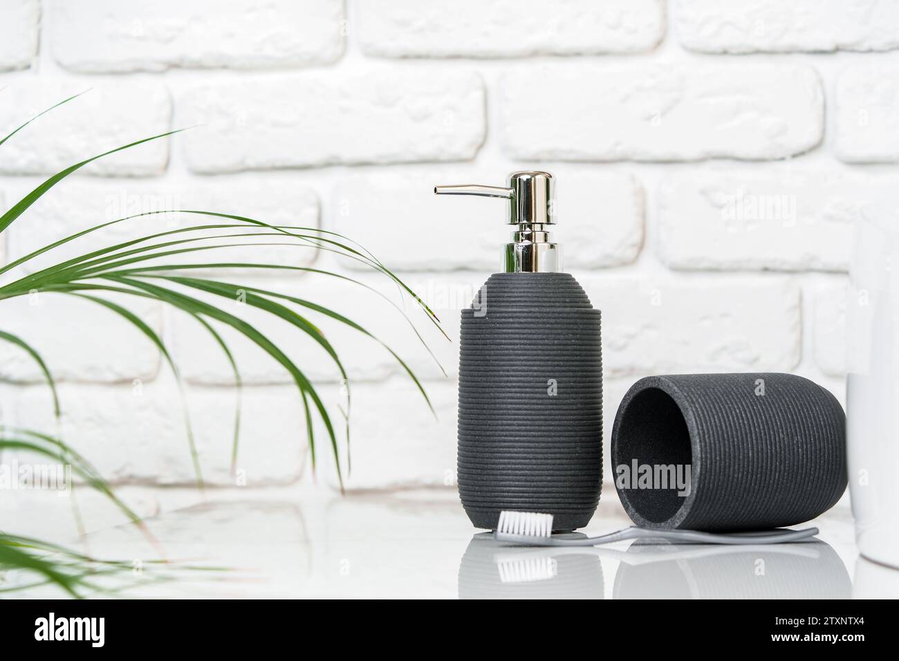 Soap dispenser container n the bathroom close up Stock Photo - Alamy