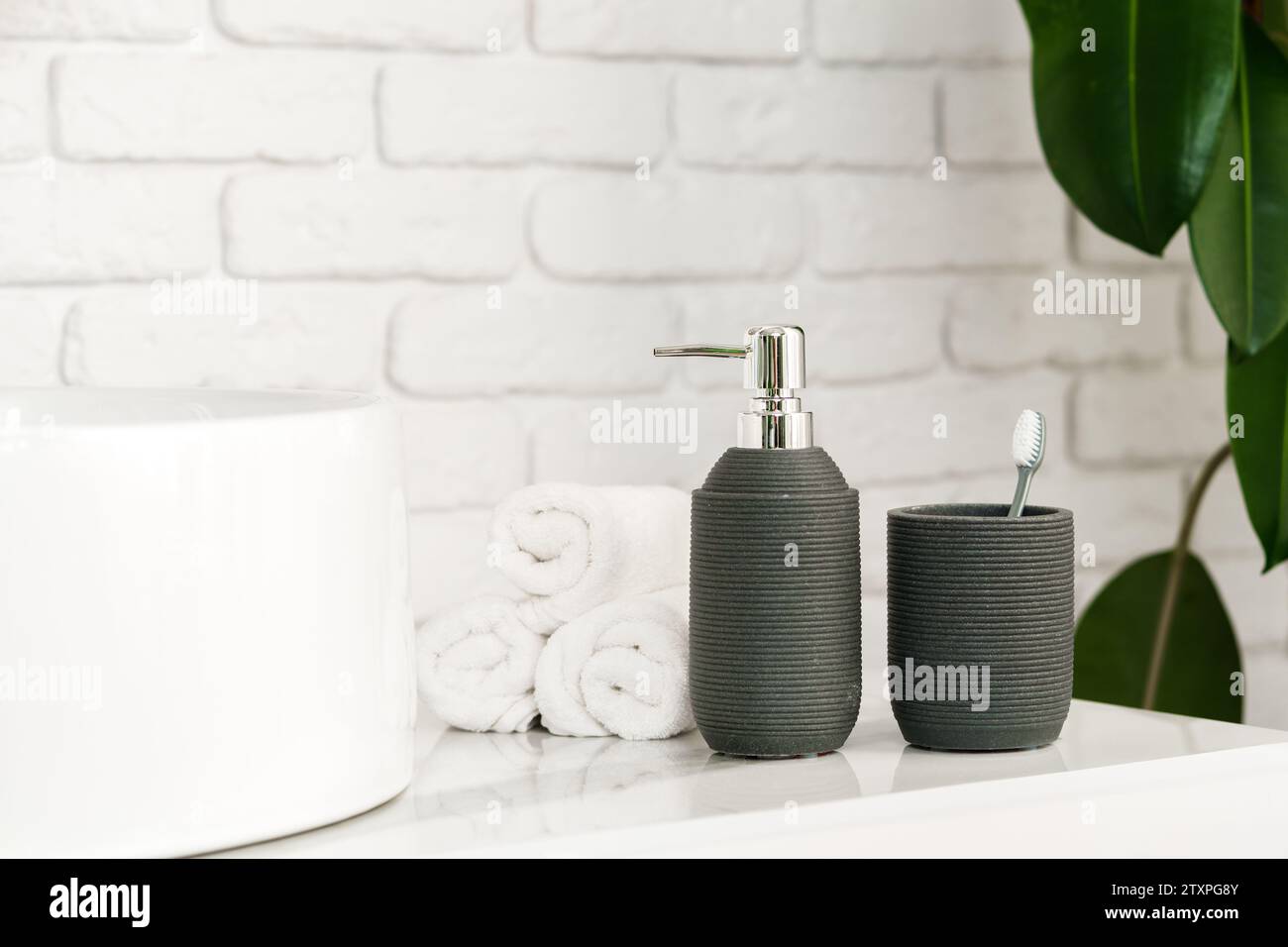 Soap dispenser container n the bathroom close up Stock Photo - Alamy
