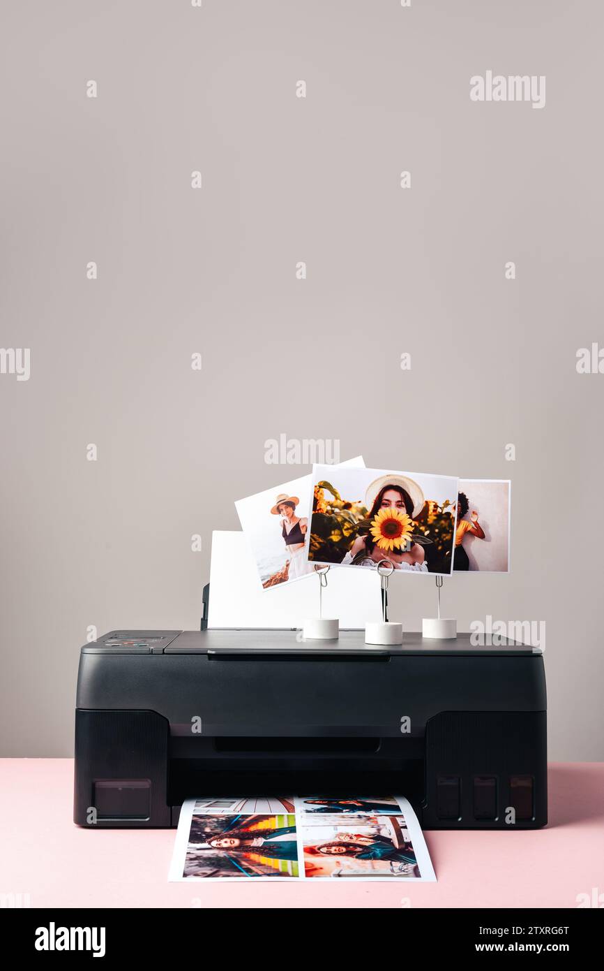 Modern laser printer printing color photos of women close up Stock ...