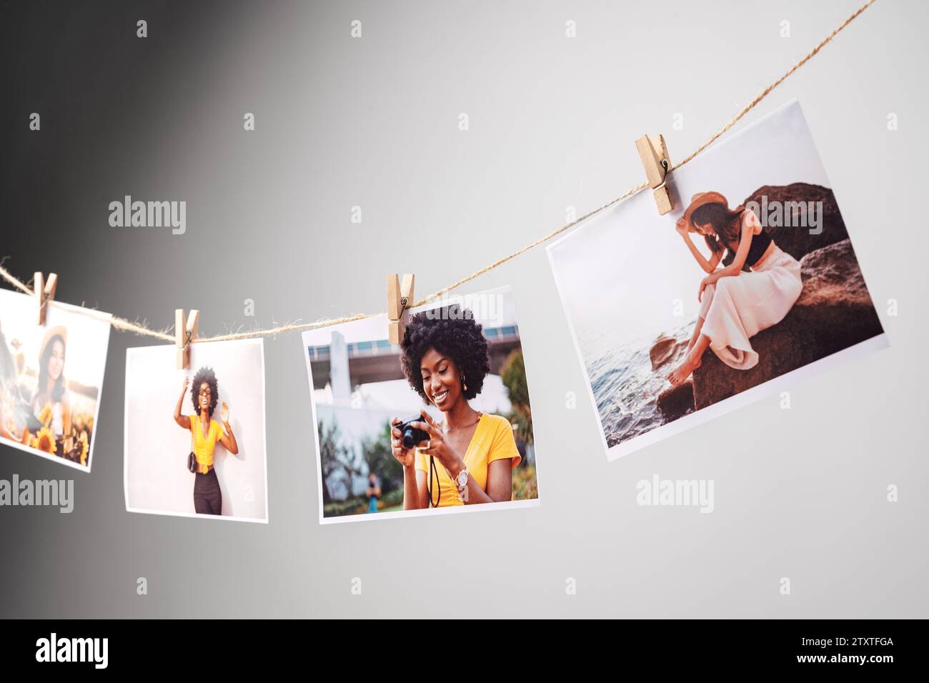 Printed colorful photos of women portraits against gray background ...