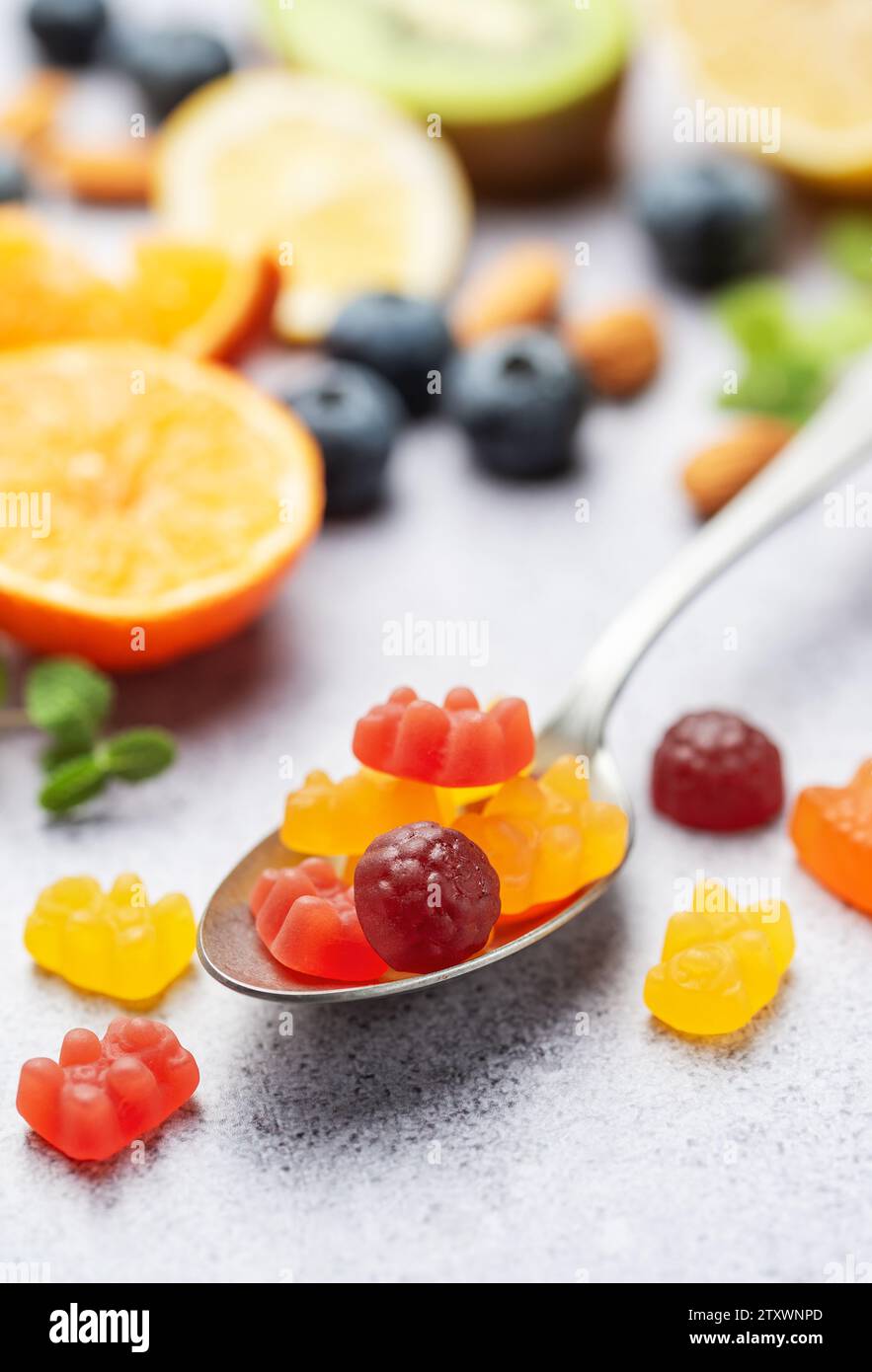 Chewable gummy bears vitamins and supplements and fresh fruits Stock ...