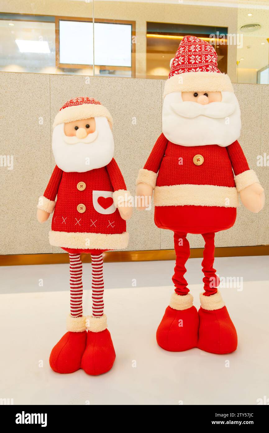 two Santa Claus dolls in the indoor at vertical composition Stock Photo ...