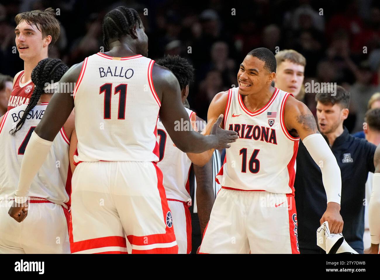 Arizona center Oumar Ballo and forward Keshad Johnson (16) celebrate ...