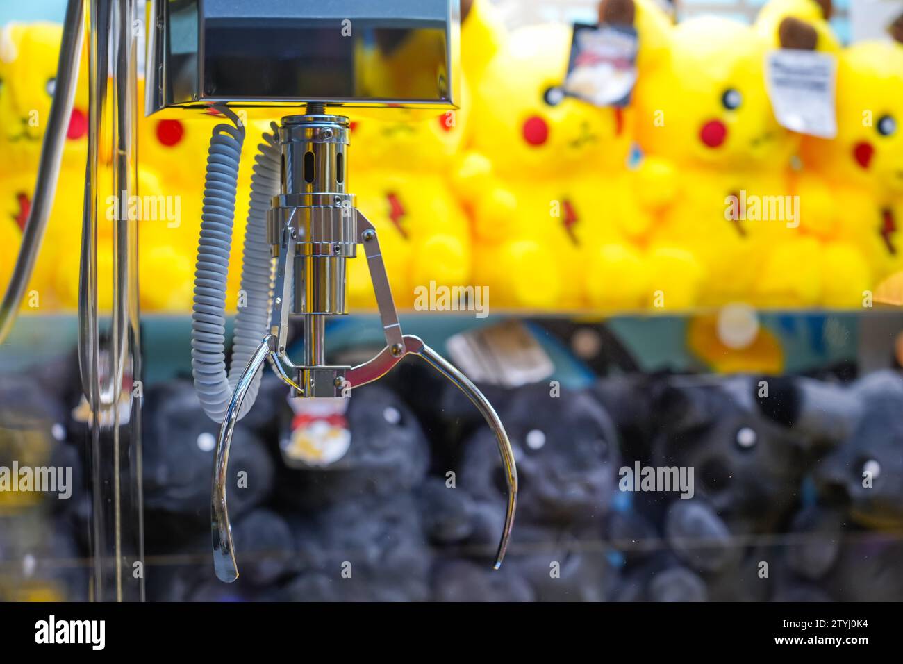 Toy crane vending machine, claw game or cabinet to catch the toys ...