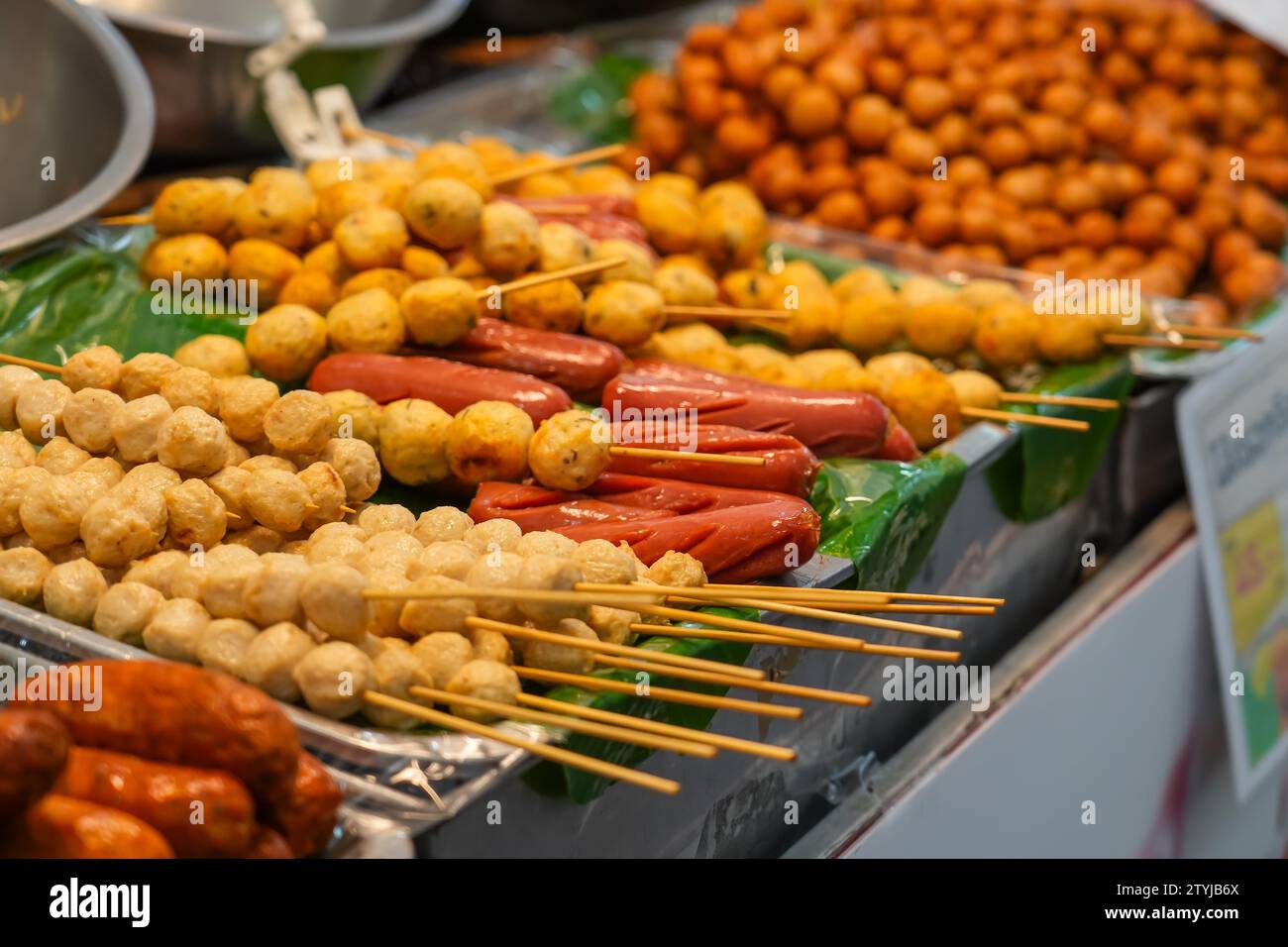 Fried food sausages and meat balls with sticks Thai style food ...