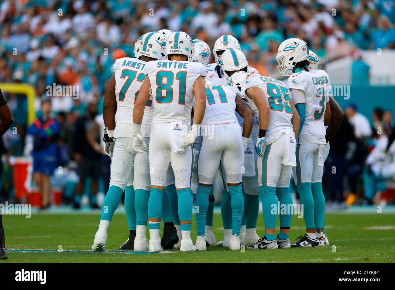The Miami Dolphins offensive unit in a group huddle during an NFL ...