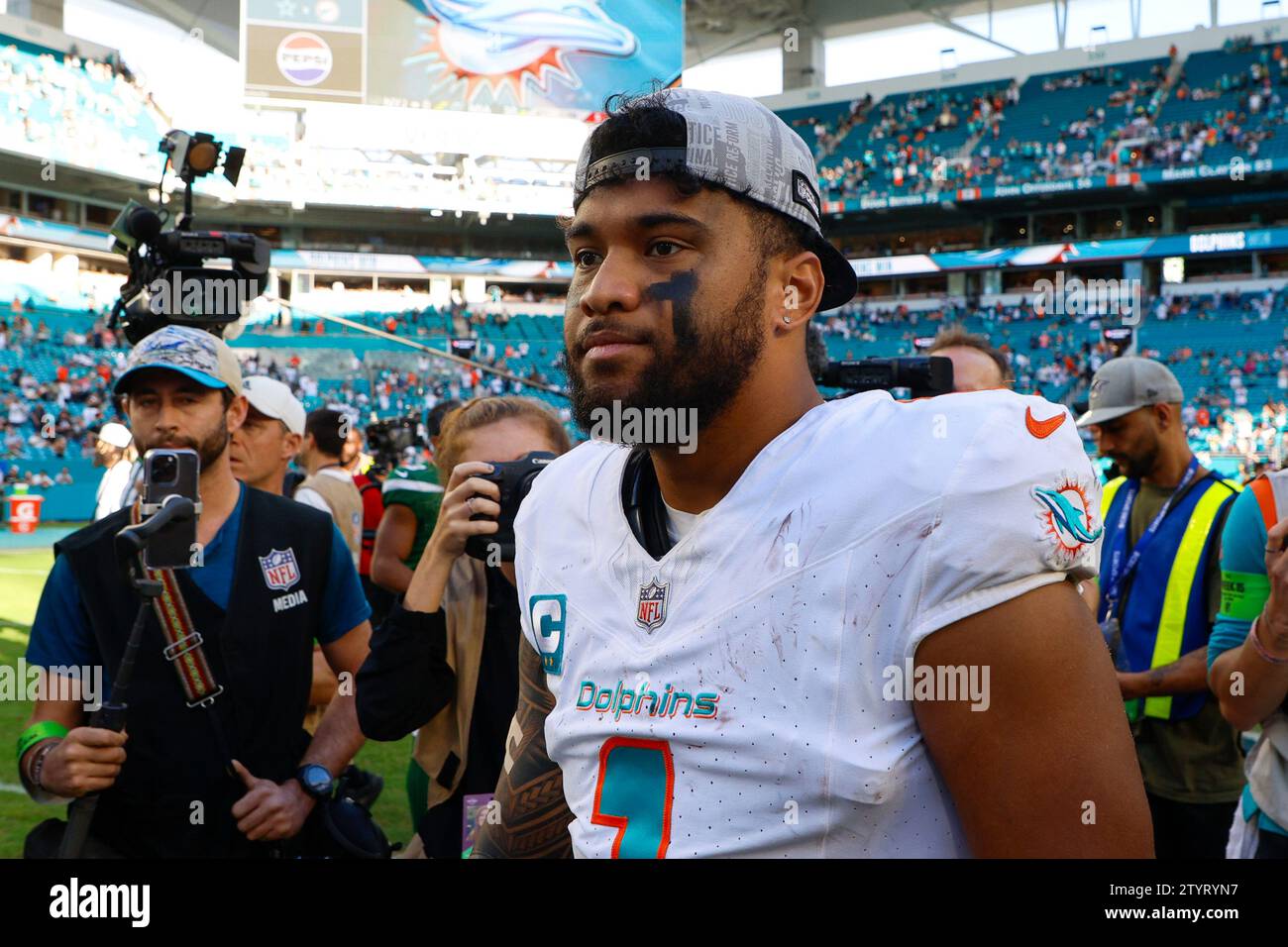 Miami Dolphins quarterback Tua Tagovailoa (1) walks on the field after ...
